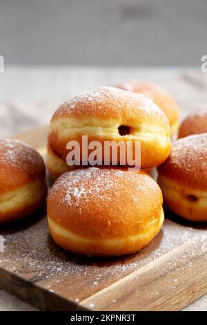 Homemade Apricot Polish Paczki Donut with Powdered Sugar on a Wooden ...
