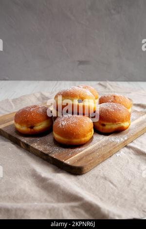 Homemade Apricot Polish Paczki Donut with Powdered Sugar on a Wooden ...