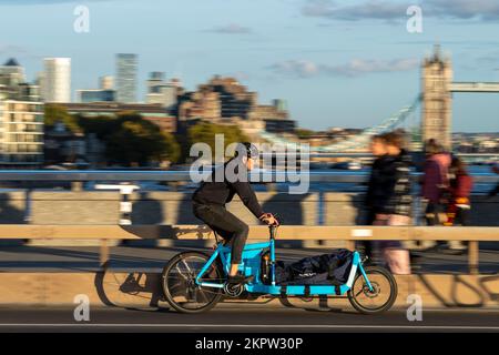 A Citysprint cycle courier riding a Bullitt e-cargo bike across, London ...