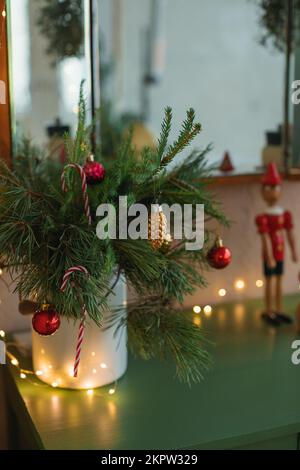 Mirror over a sideboard in a living room decorated with string lights ...