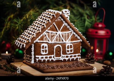 Gingerbread house with pine tree in background. Marry Christmas and ...