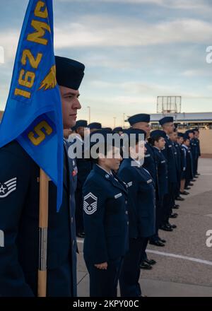 Members of the 162nd Logistics Readiness Squadron wait in formation ...