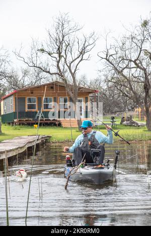 man catching largemouth bass in yak Stock Photo - Alamy
