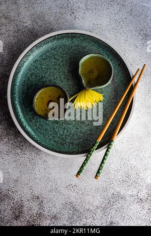 Asian green tea set with autumnal flowers Stock Photo - Alamy