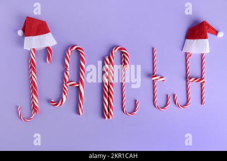 Word SANTA made of candy canes on color background Stock Photo - Alamy