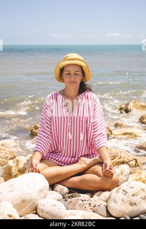 Happy relaxed woman meditation in lotus position practicing yoga ...