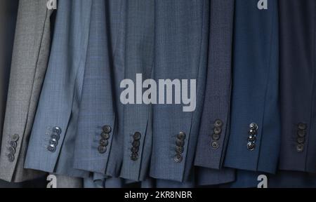 Male blazer coat and necktie neatly hanging at cupboard comfortable ...