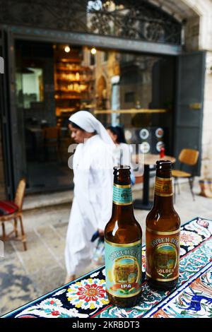 Enjoying a cold Taybeh Palestinian beer at a coffee shop / bar on the ...