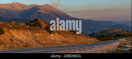 View of Mount Olympus in the fog in a frame of tree leaves. Litochoro ...