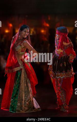Gujrati couple performing Garba on stage Stock Photo - Alamy