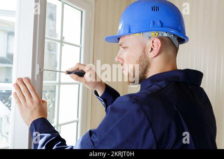 Close-up Of A Repairman's Hand Fixing Window Stock Photo - Alamy