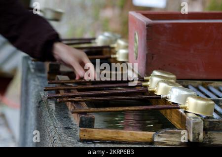 Dippers prepared for the ceremonial purification rite known as temizu ...