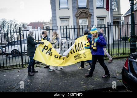 THE HAGUE - Members of Amnesty International prior to offering ...