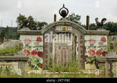 Chinese grave and ornate tombstone at cemetery graveyard Ipoh Malaysia ...