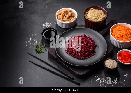 Tasty spicy Korean beet with spices and herbs on a dark concrete ...