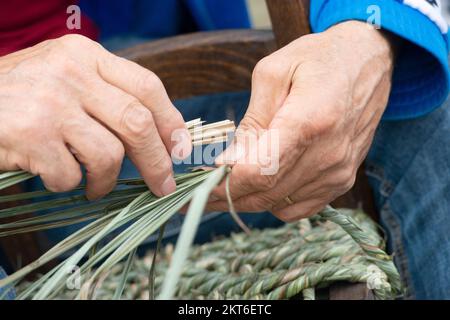 Italy, Lombardy, Chair-Mender bottoming a Chair With a Straw Stock ...