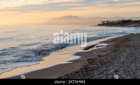 Sunset with clouds on the beaches of Marbella Stock Photo - Alamy