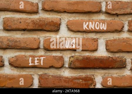 Let us know symbol. Concept words Let us know on wooden blocks on a ...