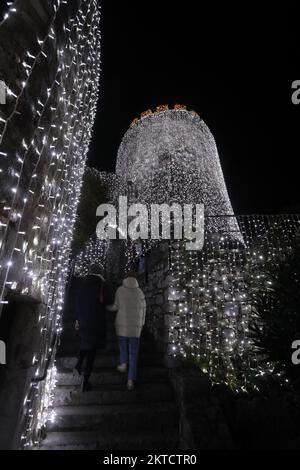 Trsat castle is decorated with lights and Christmas decorations for the ...
