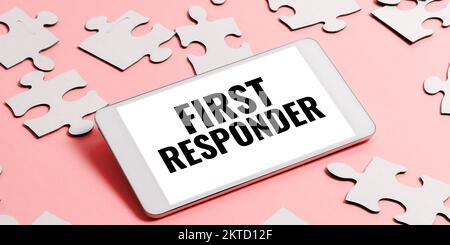 Hand writing sign First Responder. Business approach a person who is ...