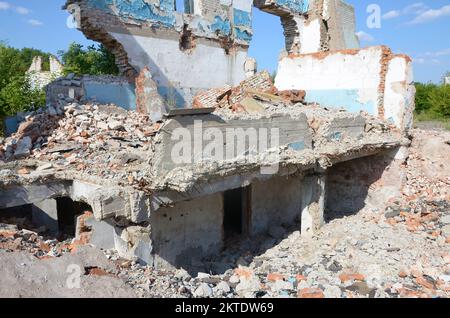 Collapsed industrial multistorey building in daytime. Disaster scene ...