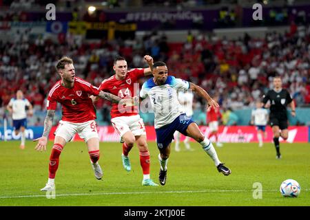 England's Callum Wilson, (right) battles for possession of the ball ...