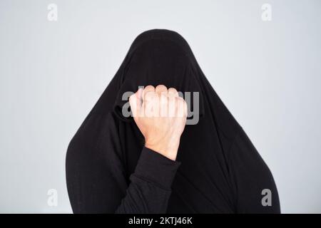 Male silhouette breaking through the fabric. Struggle and inner demon ...
