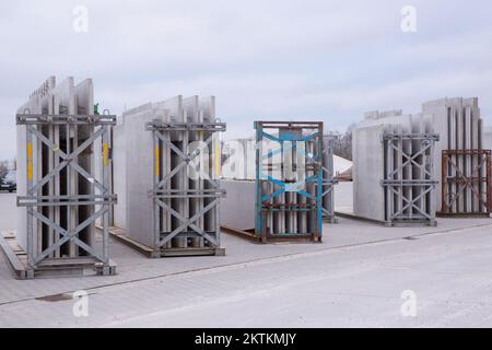 Picture of precast concrete walls ready for shipping in transport racks ...