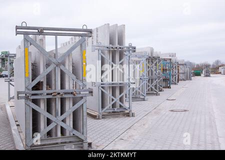 Picture of precast concrete walls ready for shipping in transport racks ...