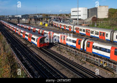 Three London tube trains pass each other at Neasden London Underground ...