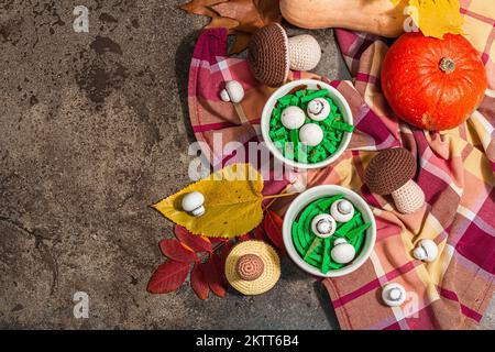 Vegan dessert with sweet mushrooms. Autumn design, pumpkin, fall leaves ...