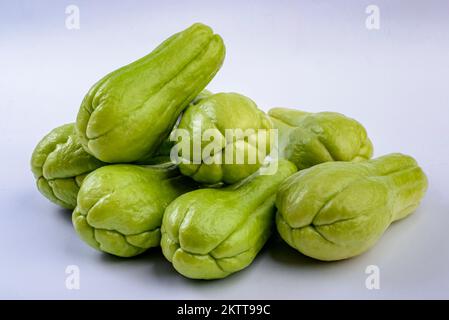Chayotes isolated on white background, with one Chayote cut in half ...