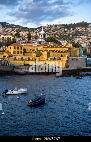 View of Forte de Sao Tiago fortress, small boats on the coast, Funchal ...