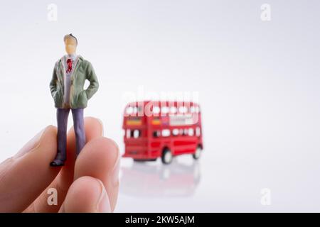 Human figure near a London Bus on a white background Stock Photo - Alamy