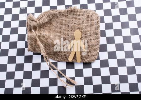 Man shape cut out of paper in hand in the view Stock Photo - Alamy