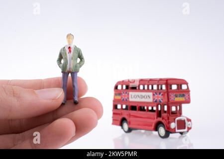 Human figure near a London Bus on a white background Stock Photo - Alamy