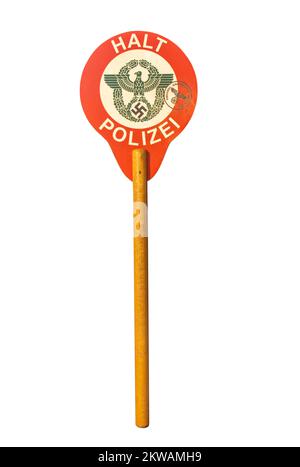 A handheld police traffic control sign with Halt Polizei, German for ...