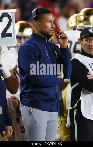 Notre Dame head coach Marcus Freeman talks with one of his players ...