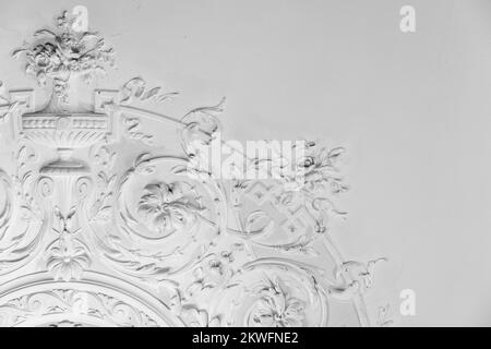 White bas-relief ceiling design details in rococo style, classic ...