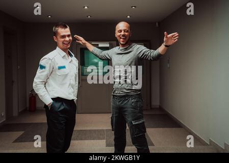Security guard making body searching procedure with a metal detector on ...