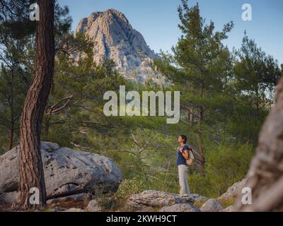 woman traveler walking by Lycian Way trail mountains in Turkey near ...