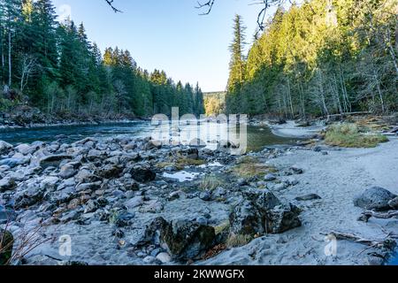 Large rocks line the Snoqaulmie River in Washington State Stock Photo ...