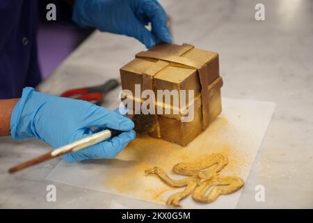 Cadbury World chocolatier Dawn Jenks adds the finishing touches to the ...