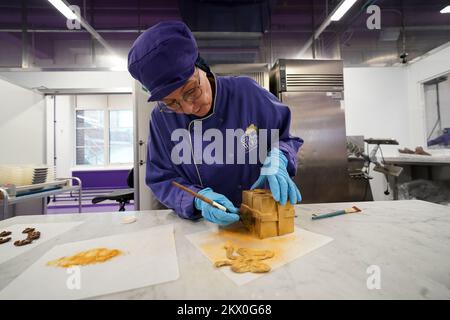 Cadbury World chocolatier Dawn Jenks adds the finishing touches to the ...