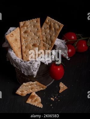 Broken cup on blue table with white pieces nearby Stock Photo - Alamy