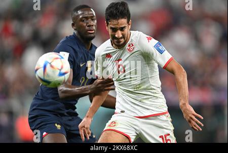 Tunisia's Mohamed Ali Ben Romdhane (left) and France's Youssouf Fofana ...