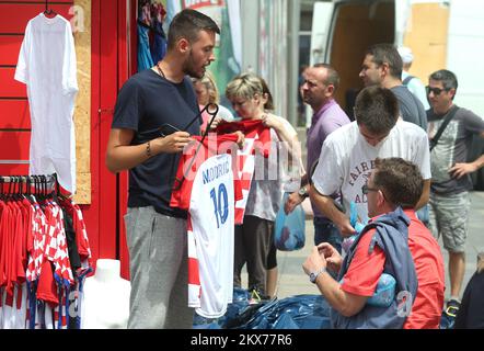 People buy soccer team jerseys in downtown Mexico City, Wednesday, June ...