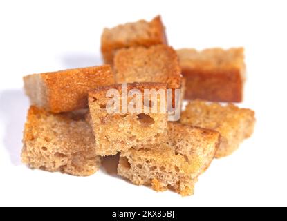 Toasted bread cubes against white background Stock Photo - Alamy