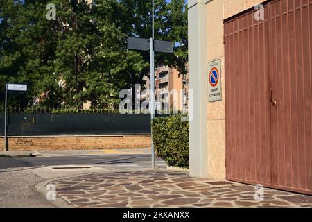 Corner of a street with garage doors in a residential area in an ...