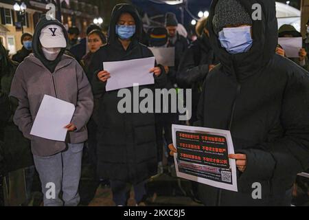 Protesters hold blank papers and placards during a demonstration ...